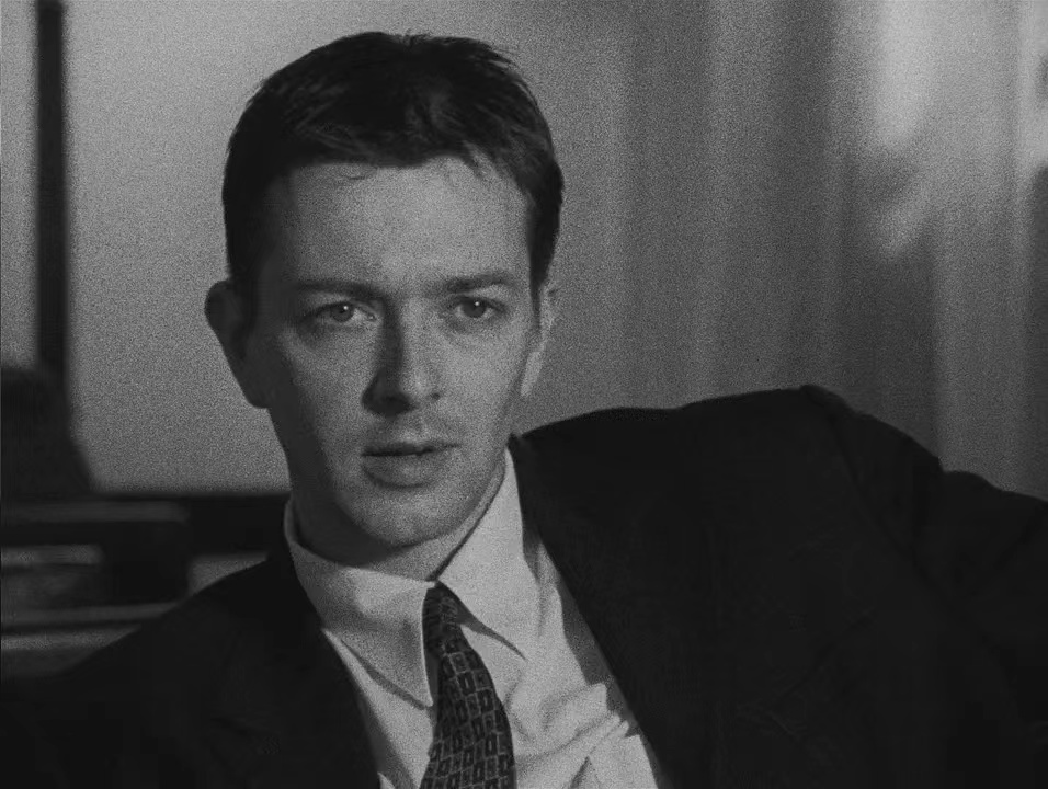 What are the characteristics of Nolan's first feature-length "Following ...