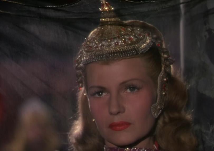 How does Hayworth's performance of "Salome" convey the emotional charm ...