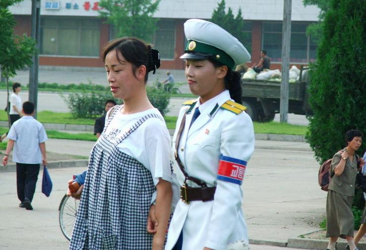 Walking into North Korea, why do North Koreans wear hats when they work ...