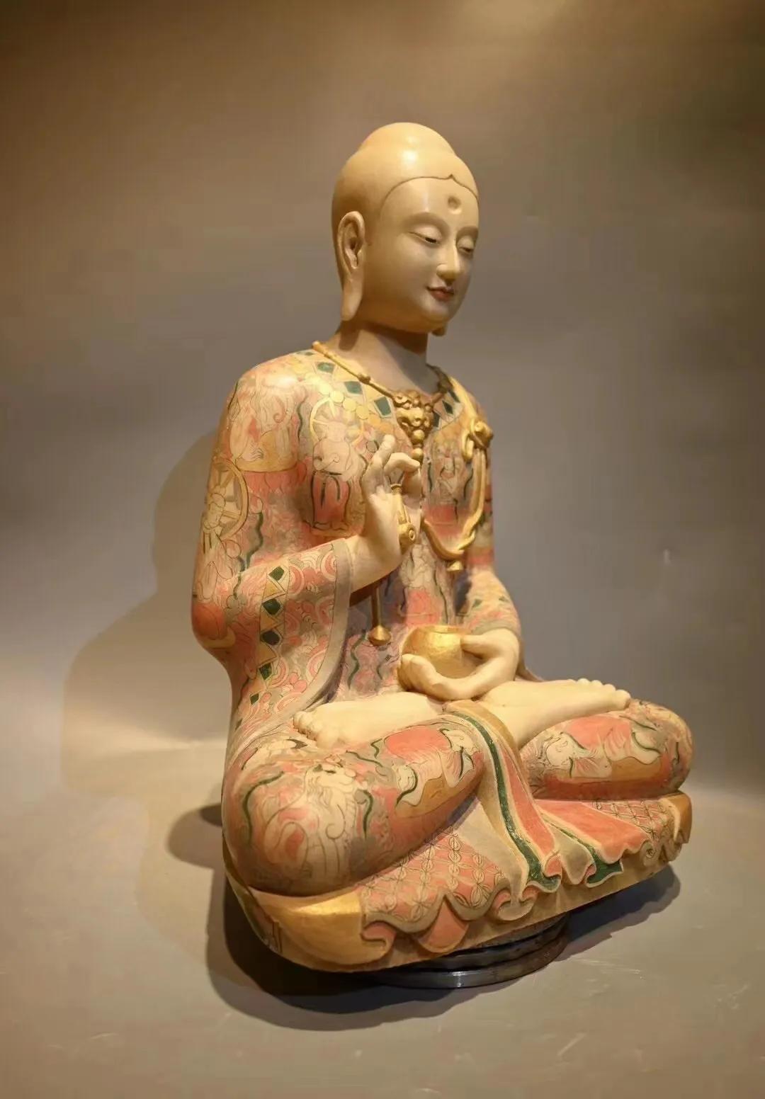 Painted Buddha statue white stone - iNEWS