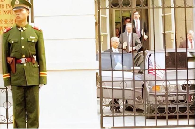 Why are Chinese soldiers standing guard with guns in front of the US ...