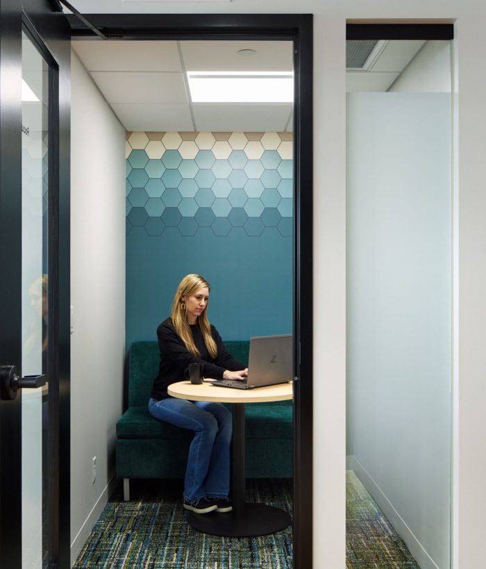 Office textures and colors are light and bright in contrast to the raw ...