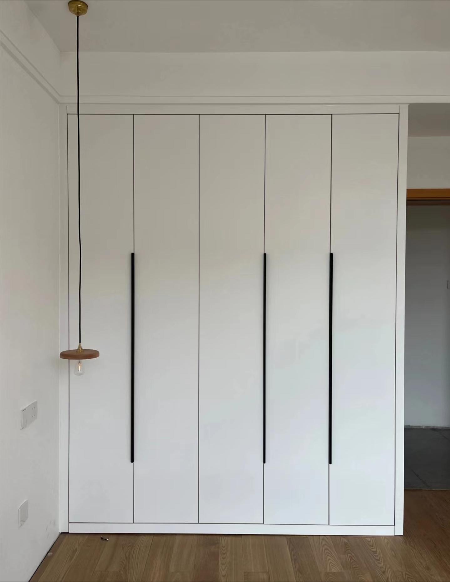 The custom-made wardrobe is both internal and external, with a high ...
