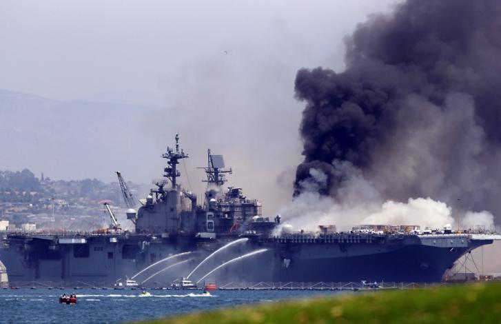 A U.S. aircraft carrier caught fire and nearly burned two other ...