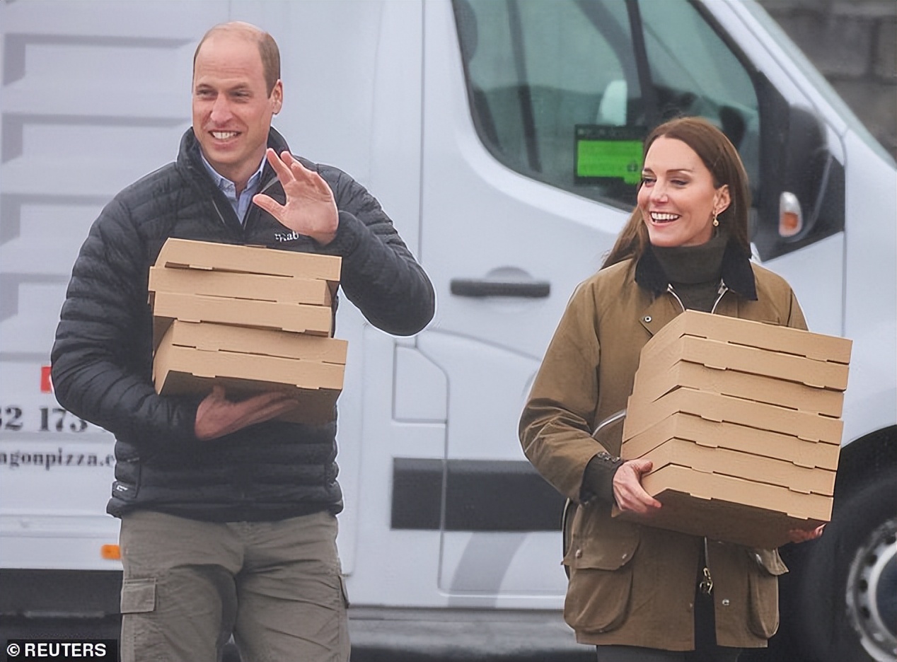 Kate bought pizza on the streets of Wales, and she held more boxes than ...