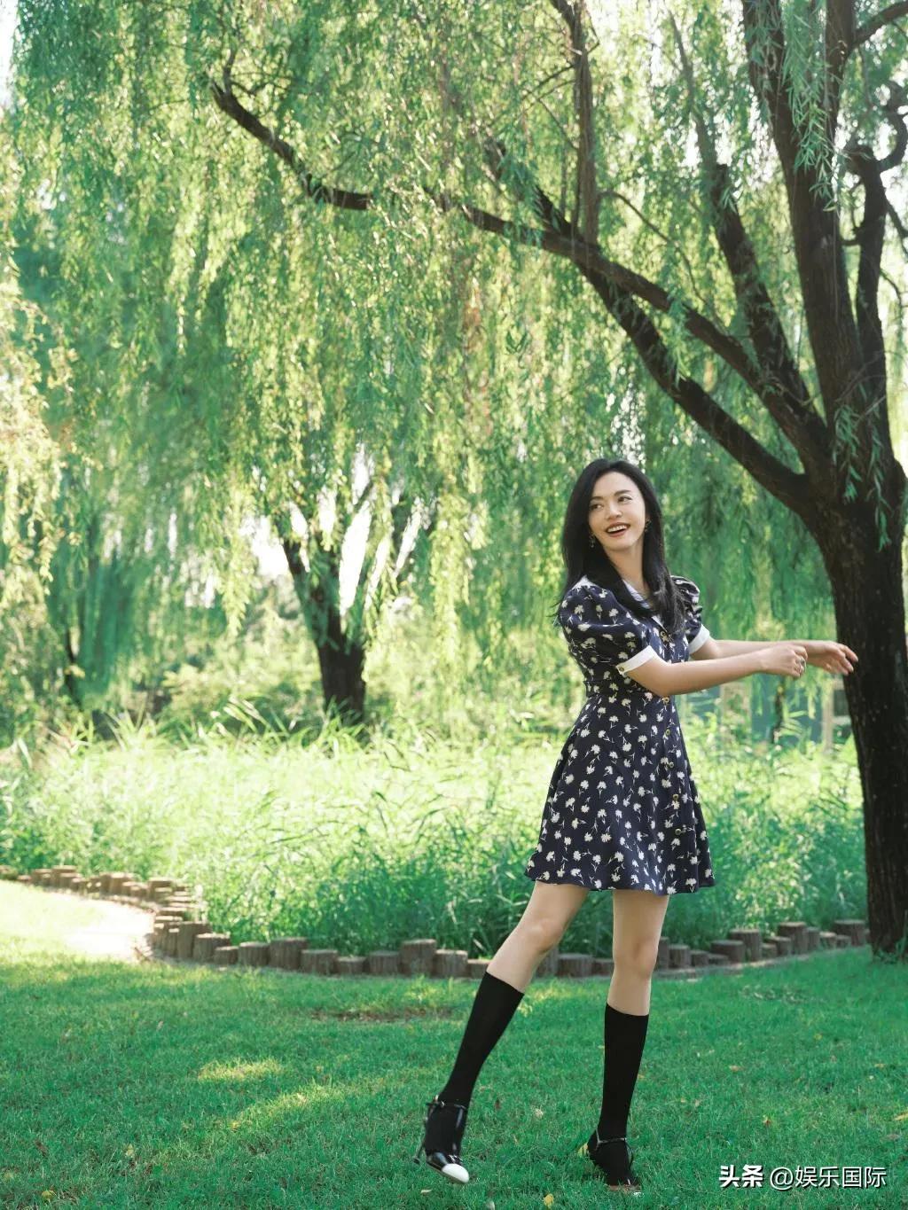 Yao Chen wears a floral dress showing beautiful legs and long hair with ...