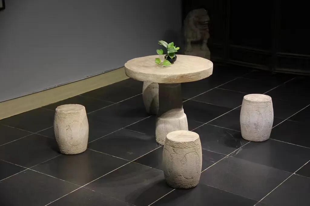 A set of stone tables A set of blue and white stone table tops are ...