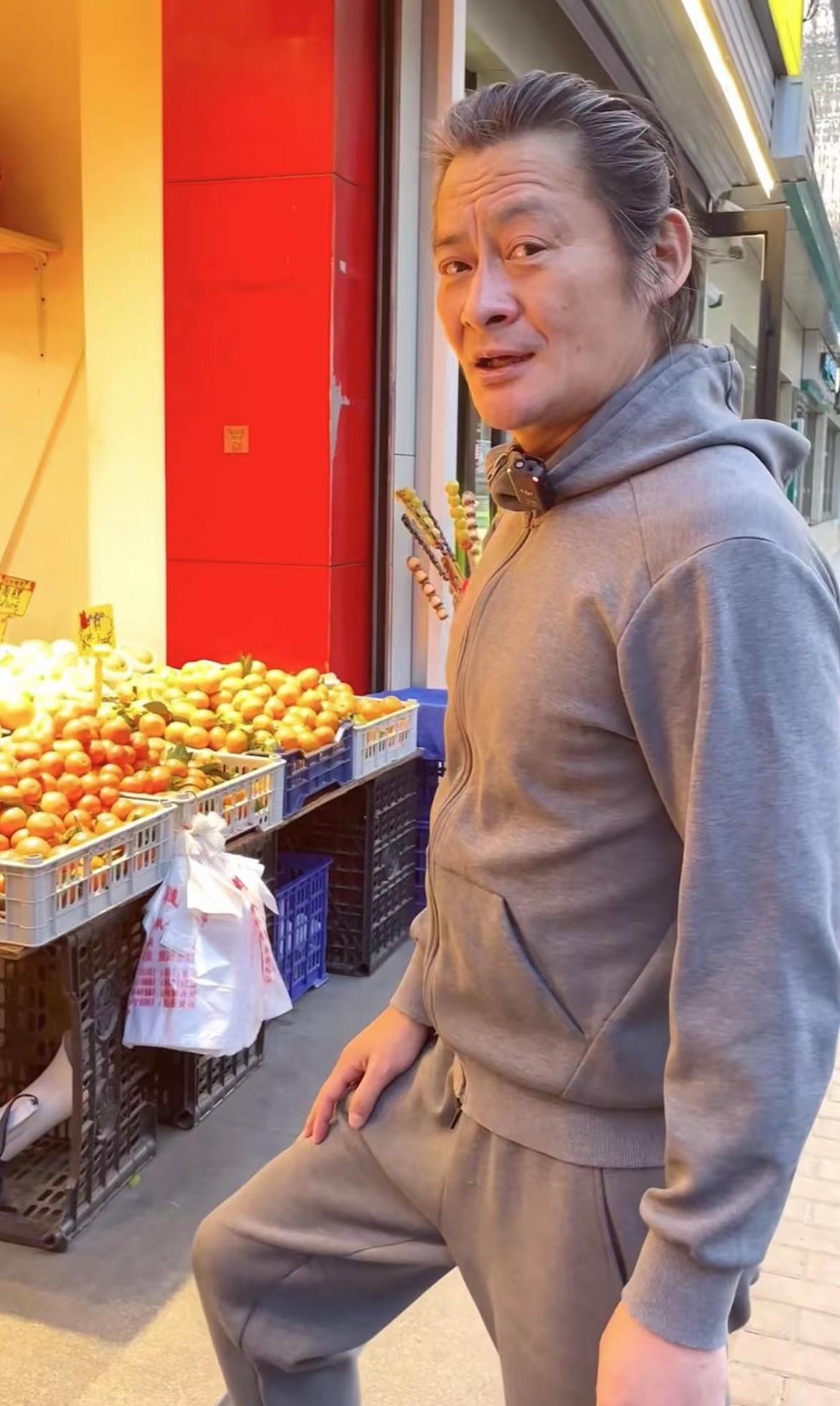 55-year-old Jing Gangshan buys food for his wife. He wears plain ...