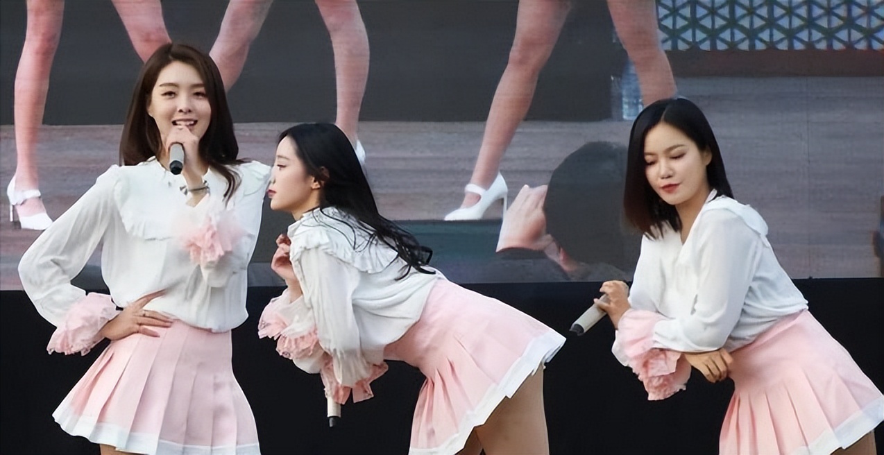 The female artist touches her genitals and licks her hands in a performance on campus. She is ...