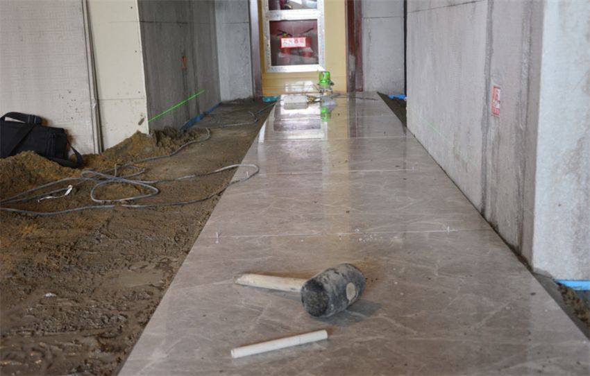 What is the difference between dry laying and wet laying of tiles? When ...