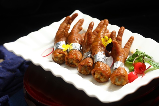 Signature appetizers: chicken feet with soy sauce.Signature dishes that ...
