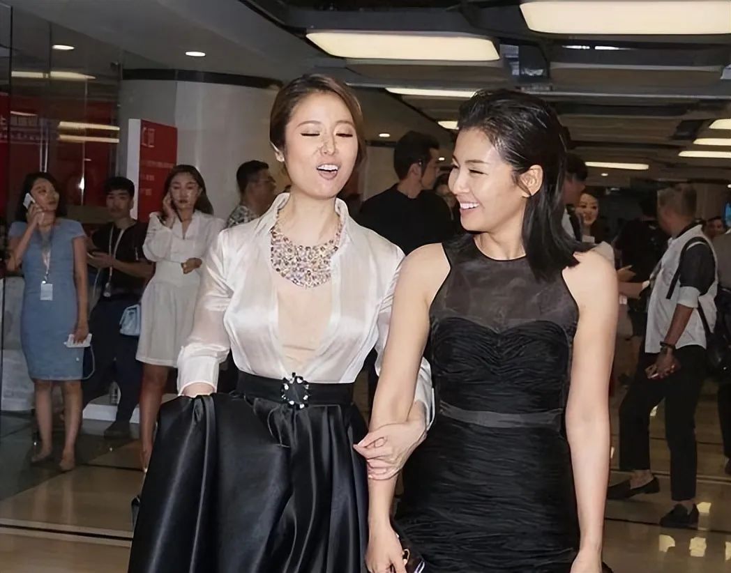 44-year-old Liu Tao and 46-year-old Ruby Lin, wearing white shirts and ...