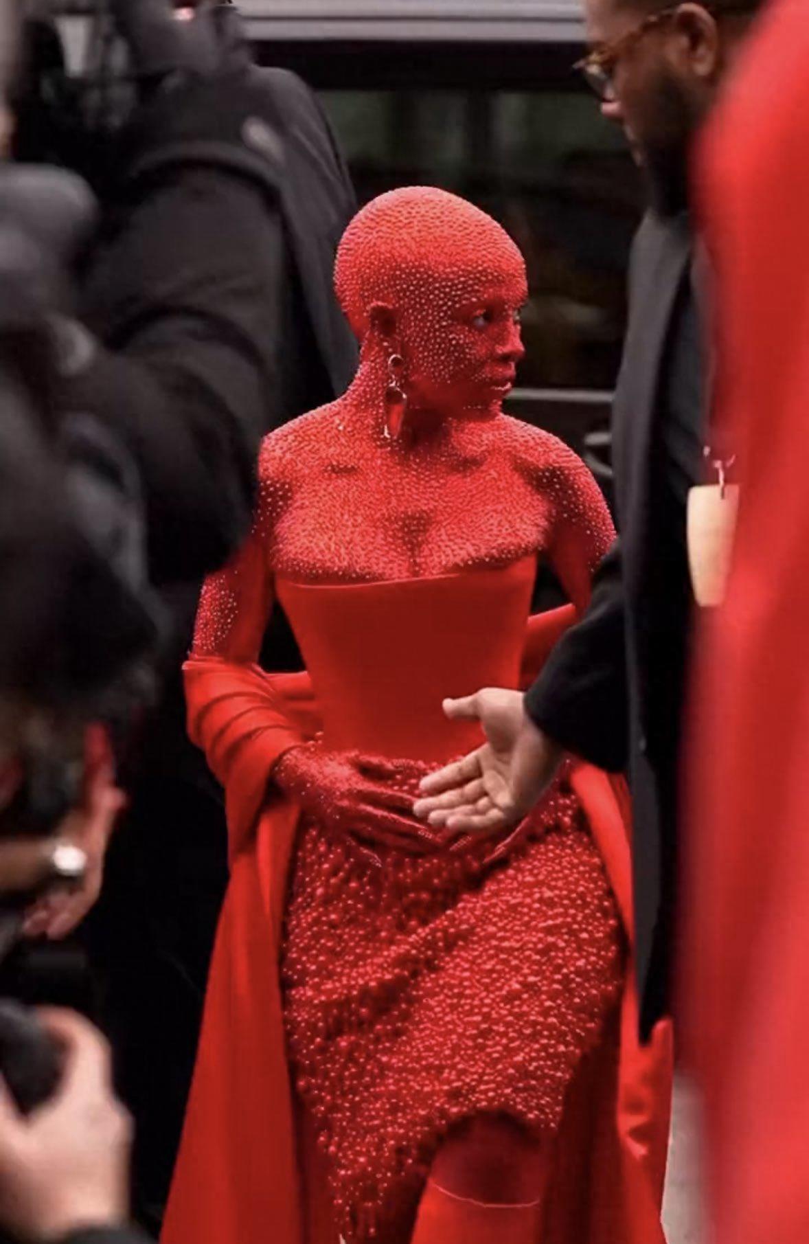 The actress' body is studded with 30,000 red crystals, which are ...