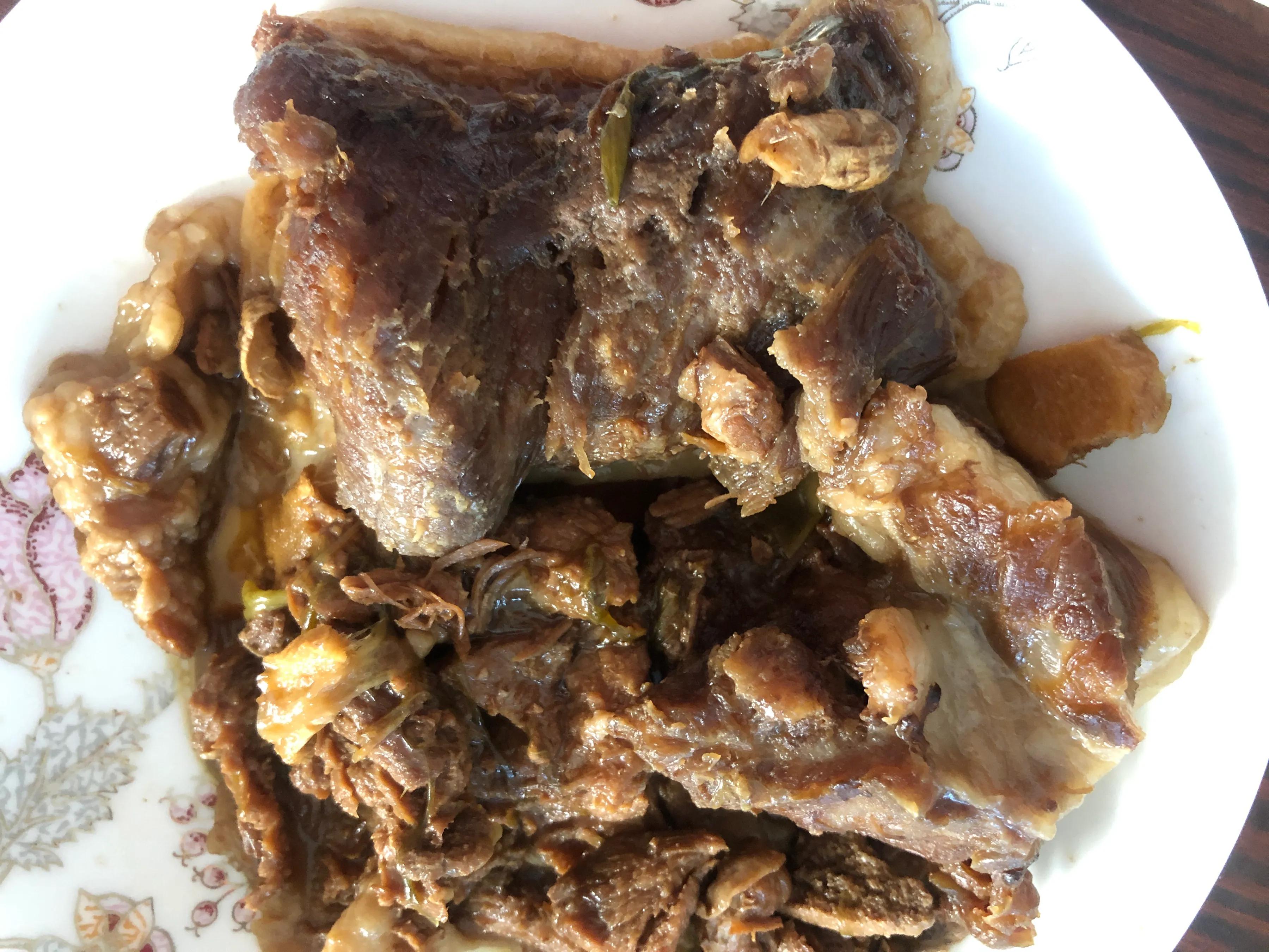 Stewed donkey meat with sliced garlic and shredded potatoes, a perfect ...