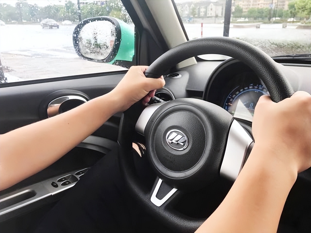 Why do many drivers hold the steering wheel with one hand? Which is ...