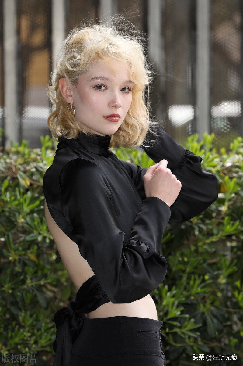 Giulia Fazzini is wearing a black suit + satin jacket with an open back ...