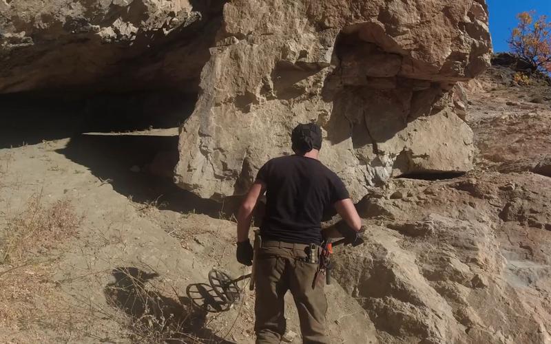 The metal detector responds to the boulder, and the treasure is hidden ...