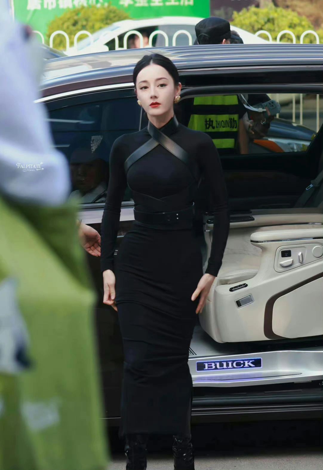 Reba wears vintage Dior earrings, and her graceful black dress is ...