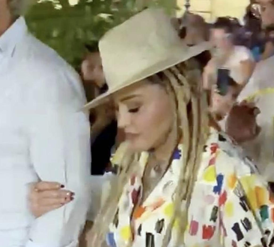 The 64-year-old Madonna and the mysterious man hold hands on the street ...
