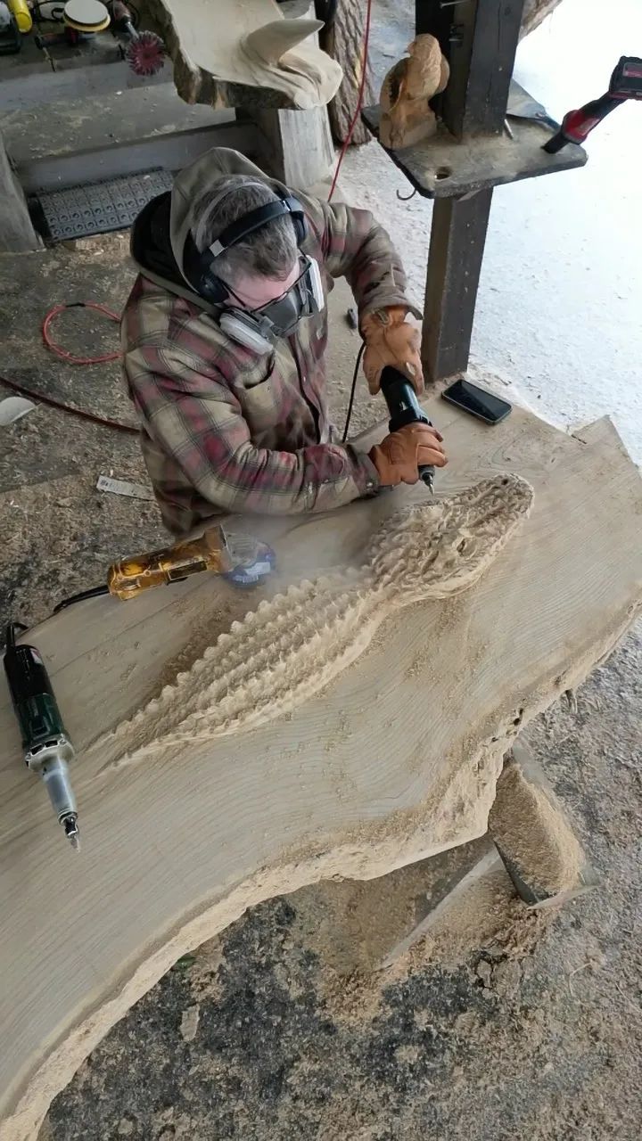 A woodcarving artist specializes in carving ferocious beasts, which are ...