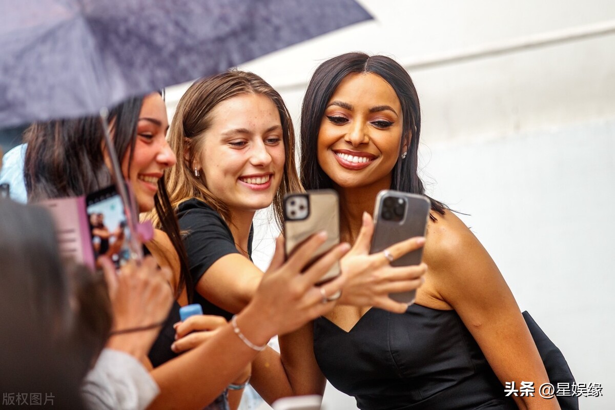 Kate Graham takes photos with fans outside hotel during Cannes Film ...
