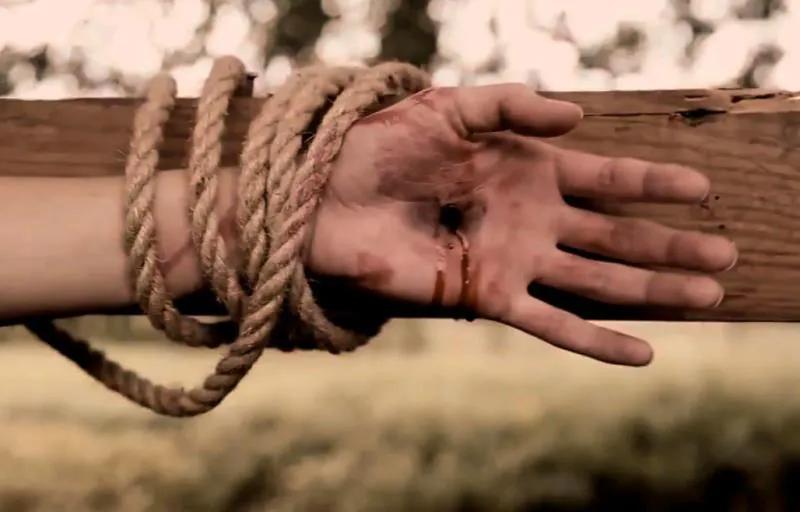 The hero nailed to the wooden frame was brutally killed by the enemy ...