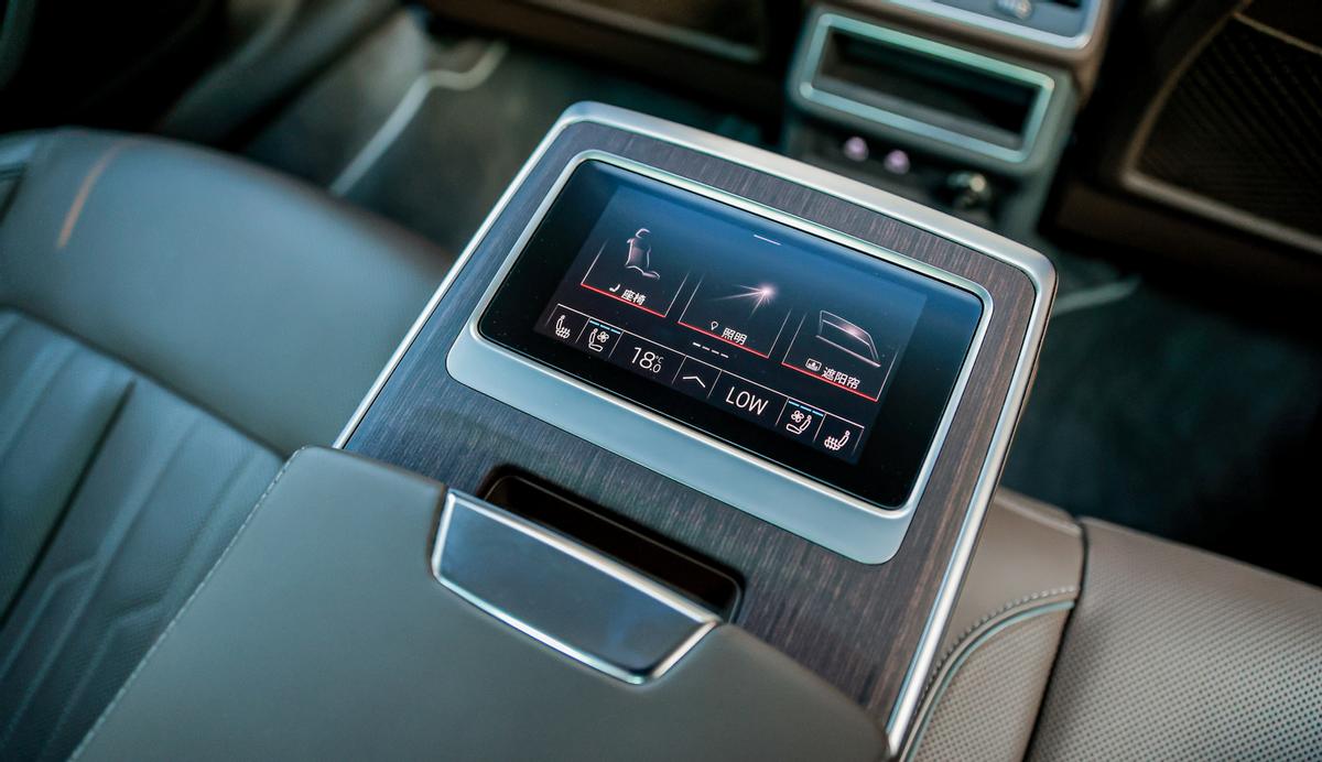 The classic design of three large screens on the center console, the ...