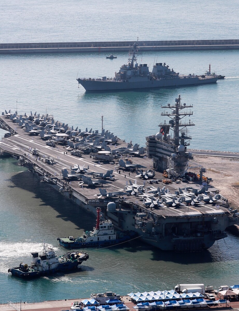 The amphibious assault ship USS America docks in Osaka, indicating that ...