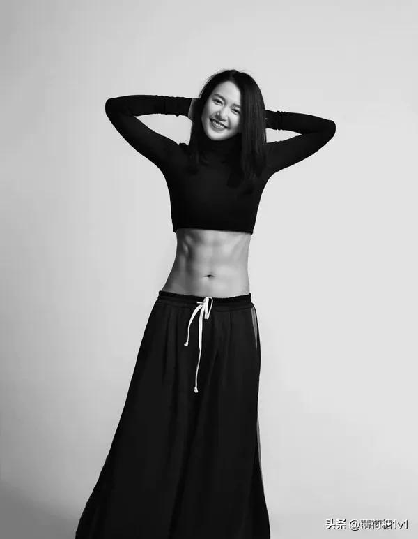 With tattooed arms and eight-pack abs, female rock singer Tan Weiwei is ...