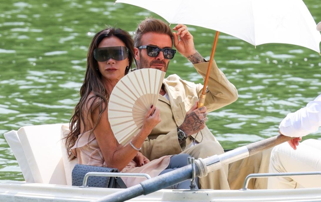 It is too sweet! Beckham and his wife took a boat to watch the show ...