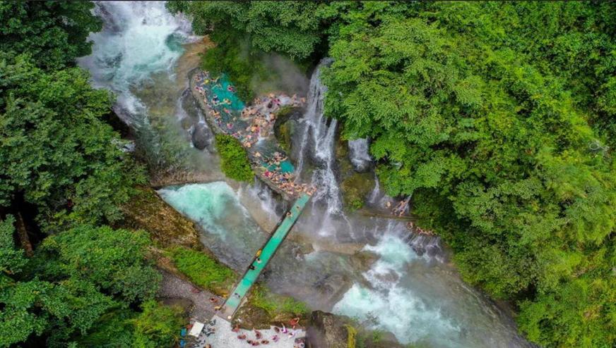 The world's largest hot spring waterfall - Luoji Jiujiuli Waterfall ...