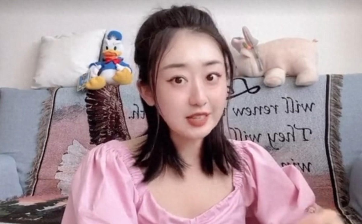 Kenci puts his arm around his female manager's shoulders and she helps ...