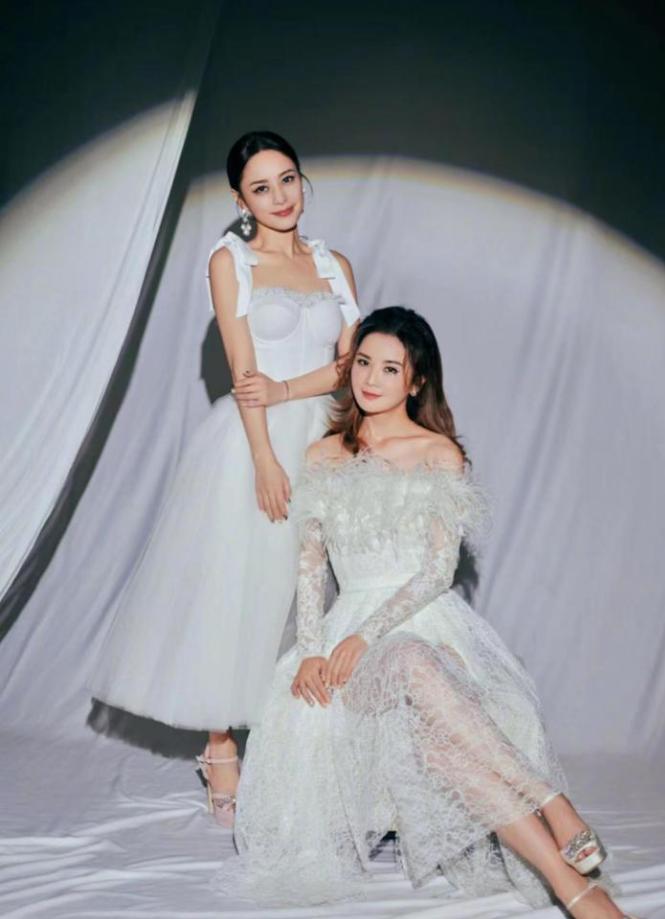 Twins fit together, Gillian and Ah Sa are all wearing white dresses, one sweet and one ...