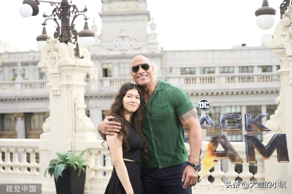Dwayne Johnson hugs and poses with fans at the press conference of his ...