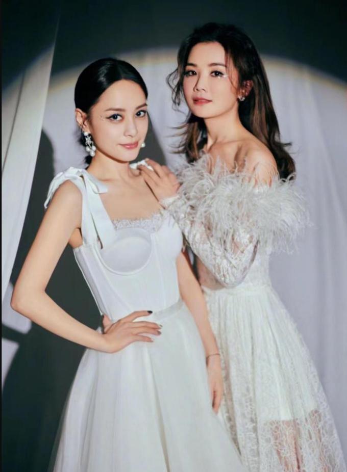Twins fit together, Gillian and Ah Sa are all wearing white dresses, one sweet and one ...