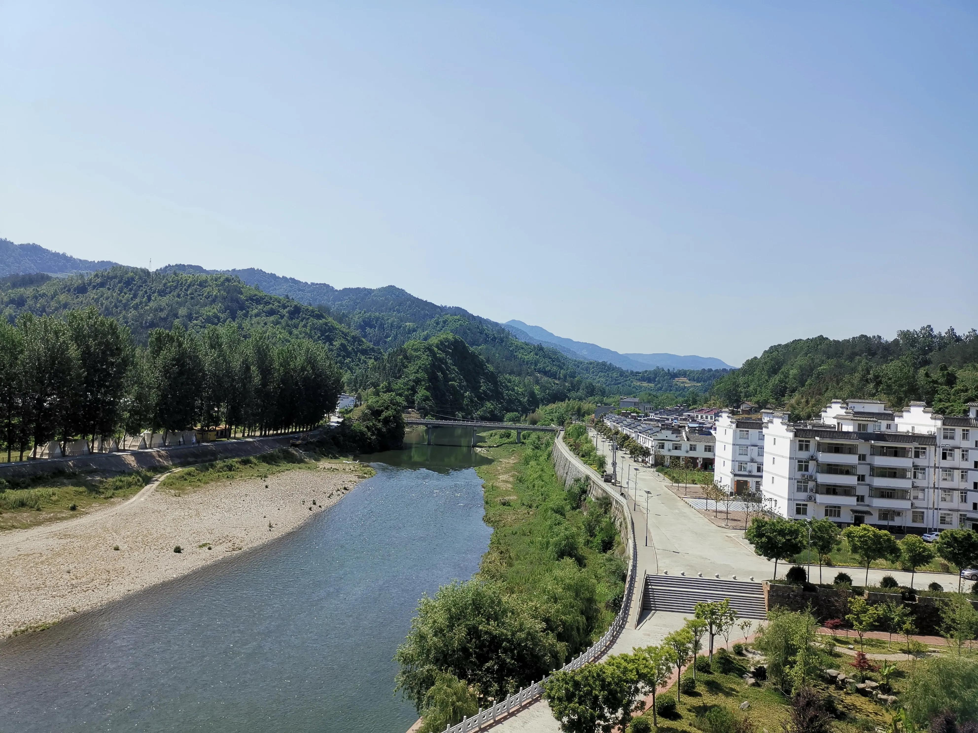 The idyllic town is picturesque and there are people in the depths of ...