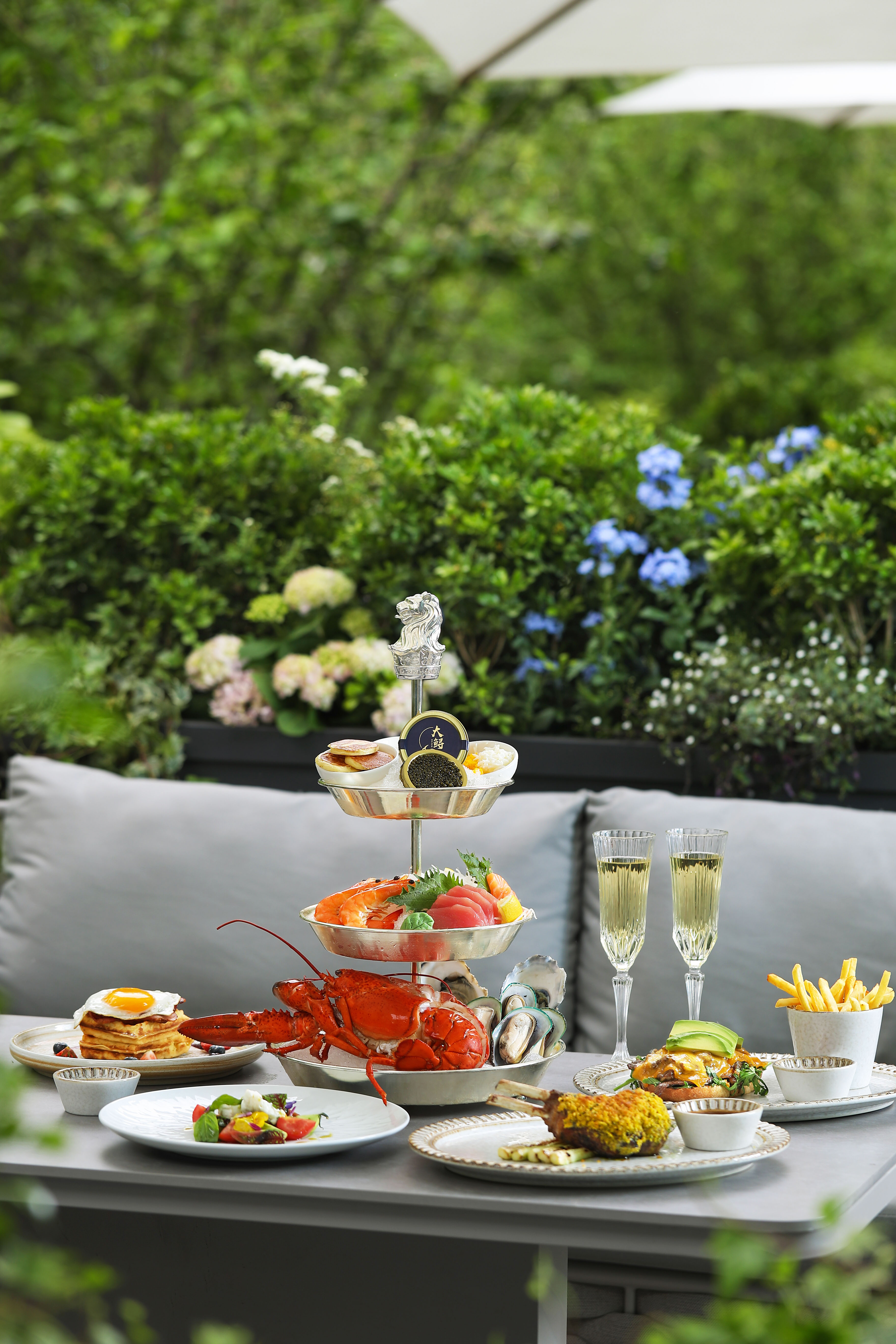 The outdoor terrace of the lobby lounge of The Ritz-Carlton Beijing is ...