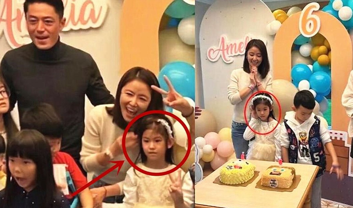 Ruby Lin holds her 7-year-old daughter with a doting look on her face ...