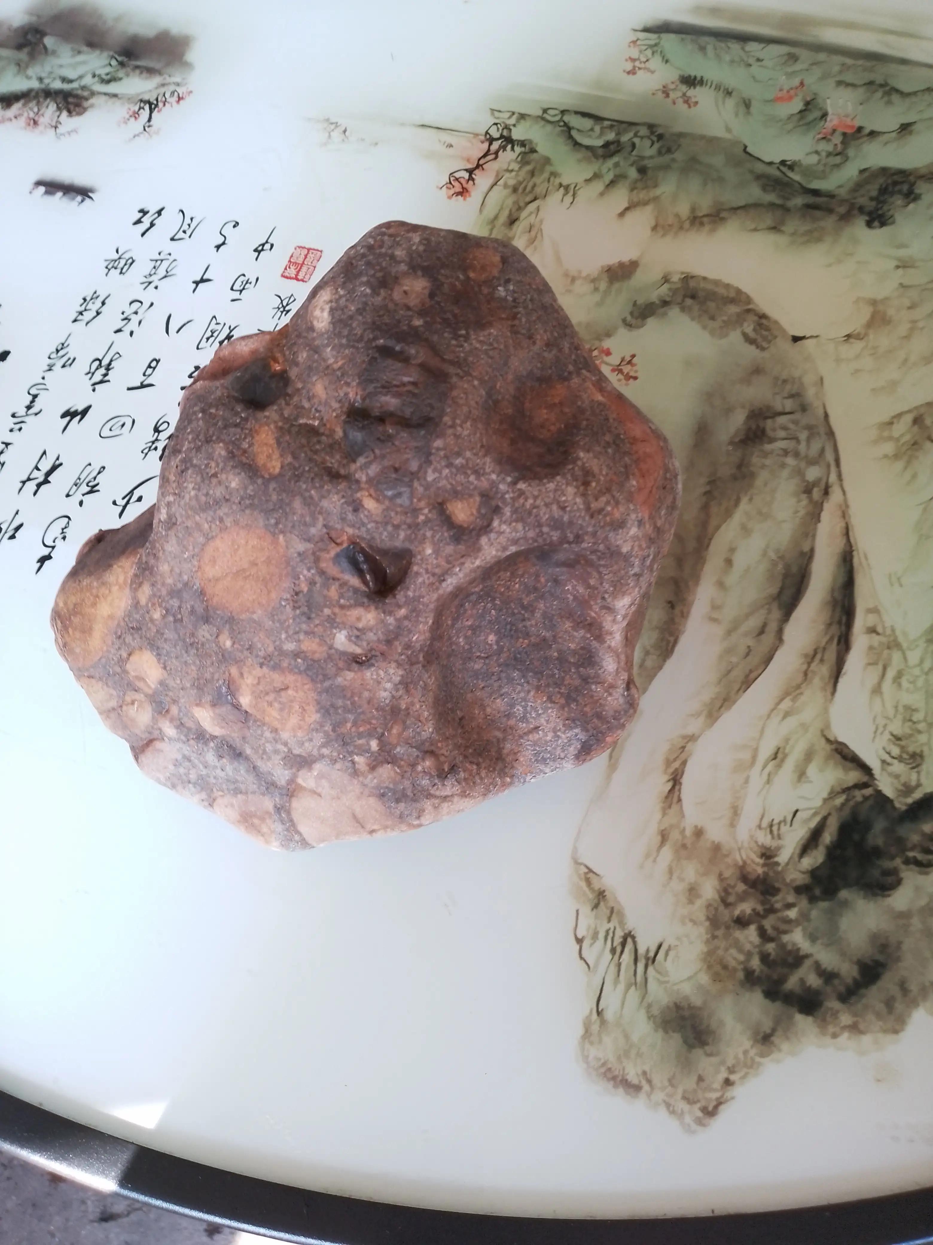 Pictures of lunar igneous rock meteorites with airmarks - iNEWS