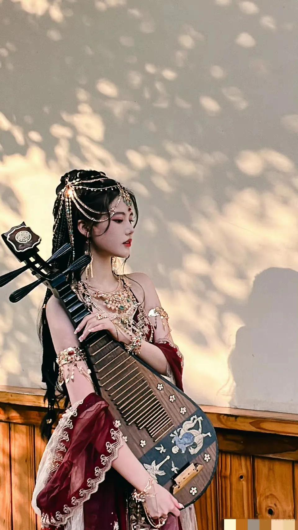 Jenny Sun's photo of the Western Regions, holding a pipa, with a ...