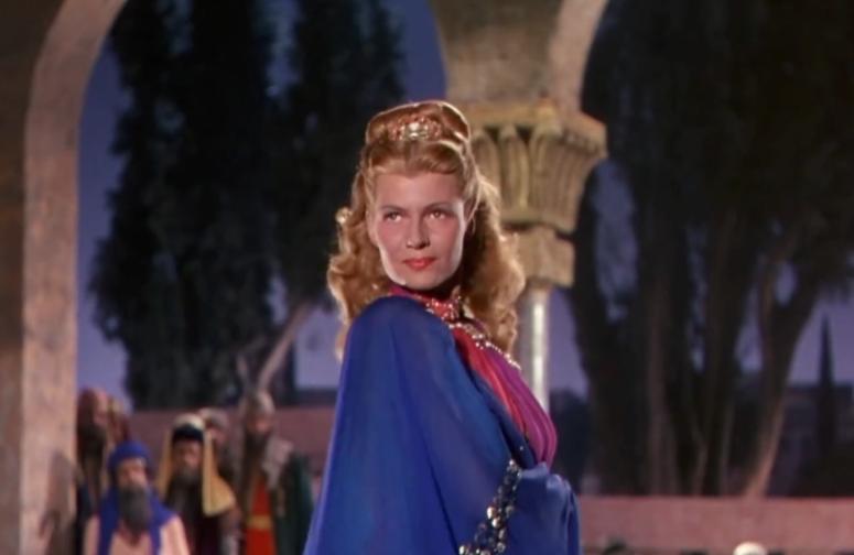 How does Hayworth's performance of "Salome" convey the emotional charm ...