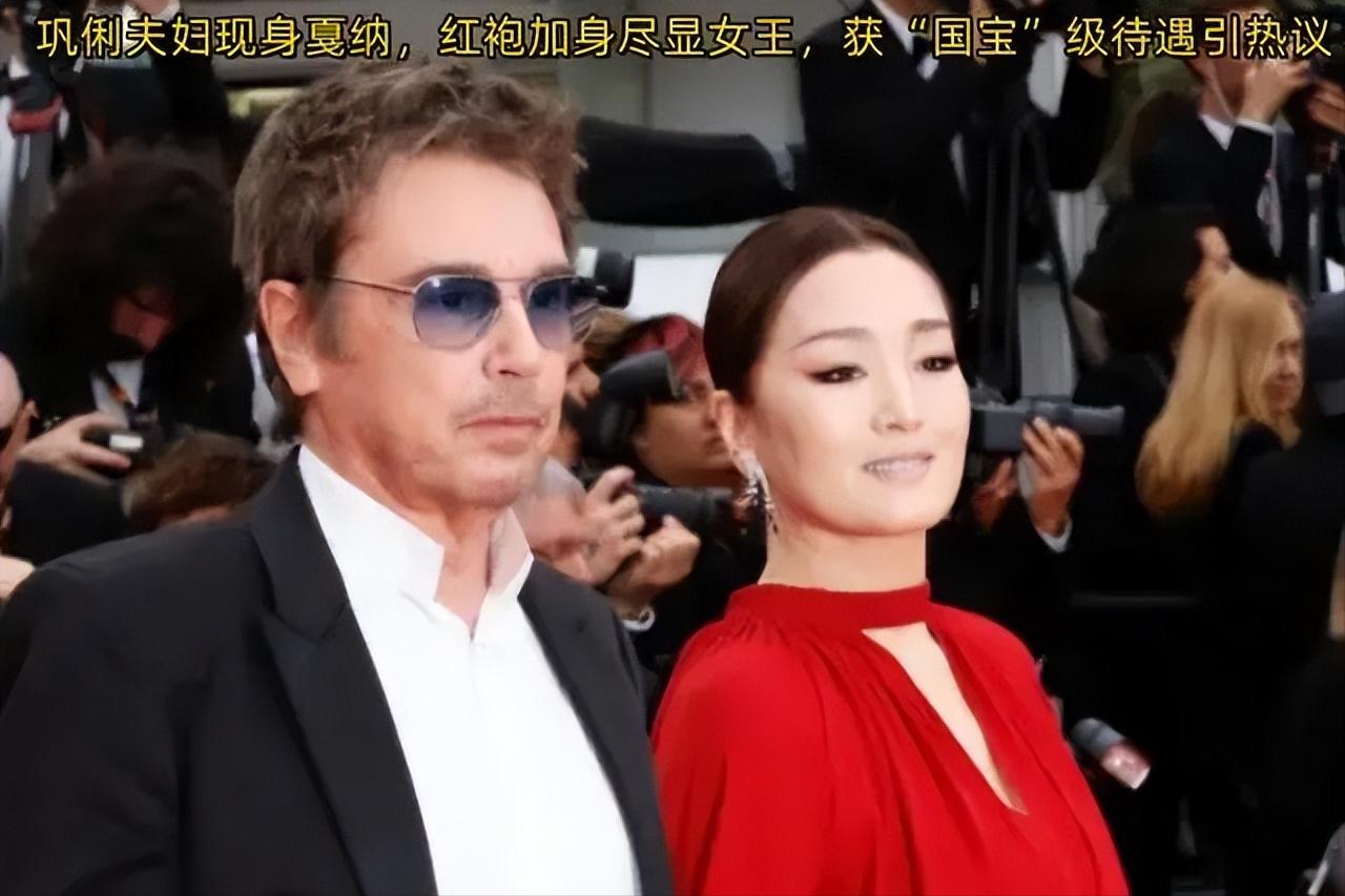 Gong Li and her husband walked the red carpet in Cannes, dressed in a ...