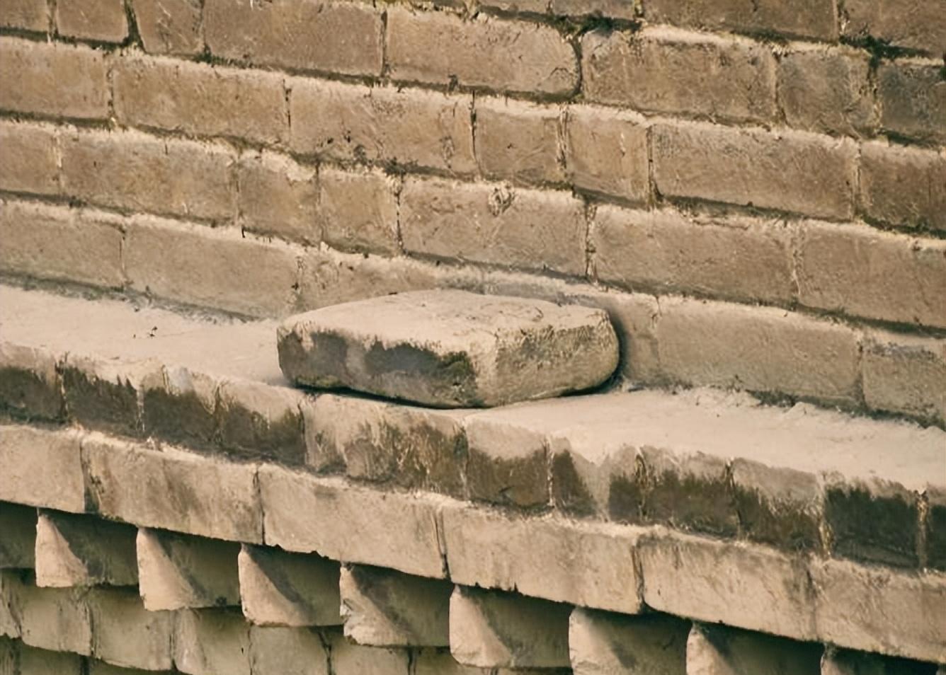 There is an extra brick on the city wall of Jiayuguan. Why has no one ...