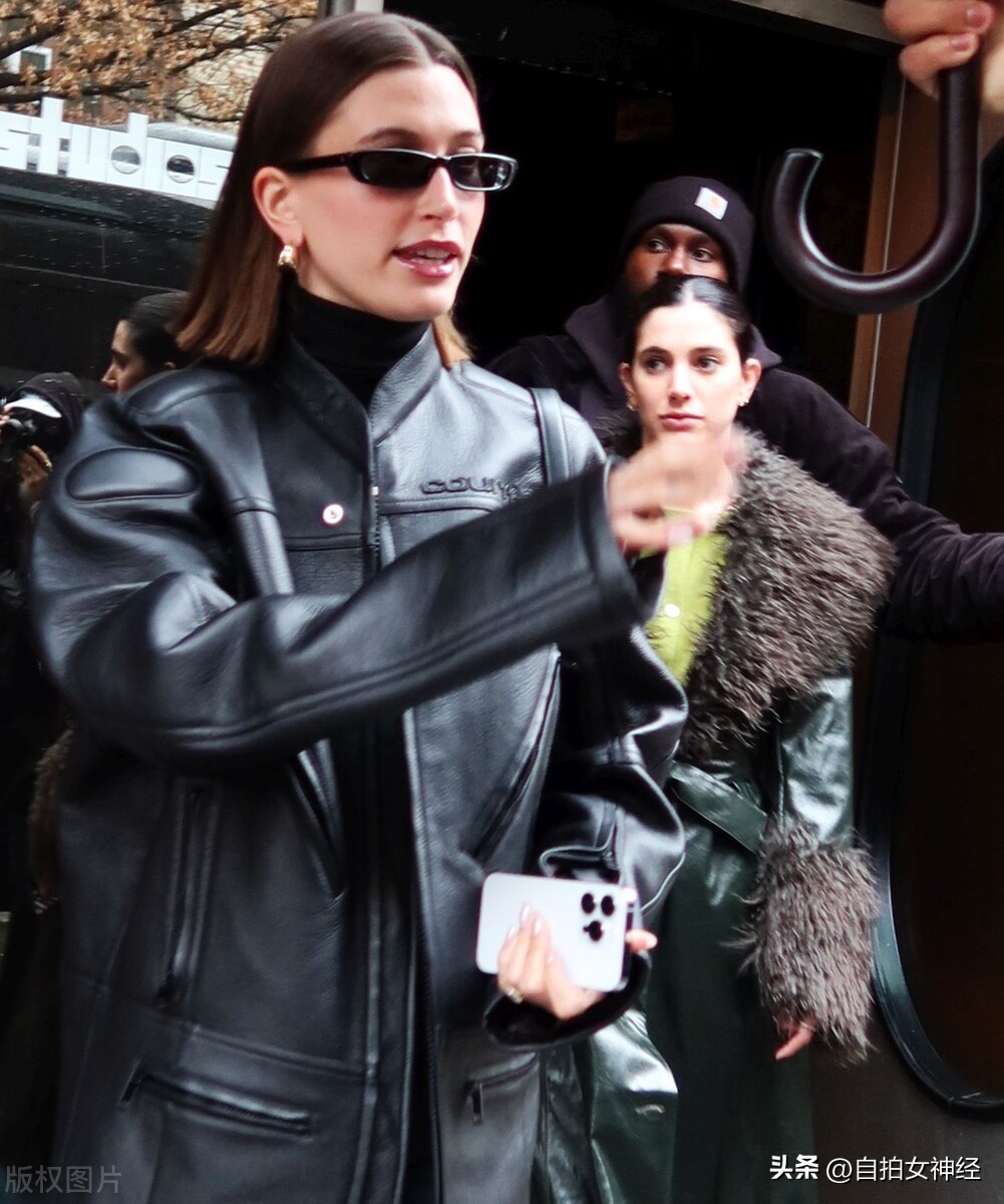 Hailey Bieber is handsome in a long leather jacket + denim wide-leg ...