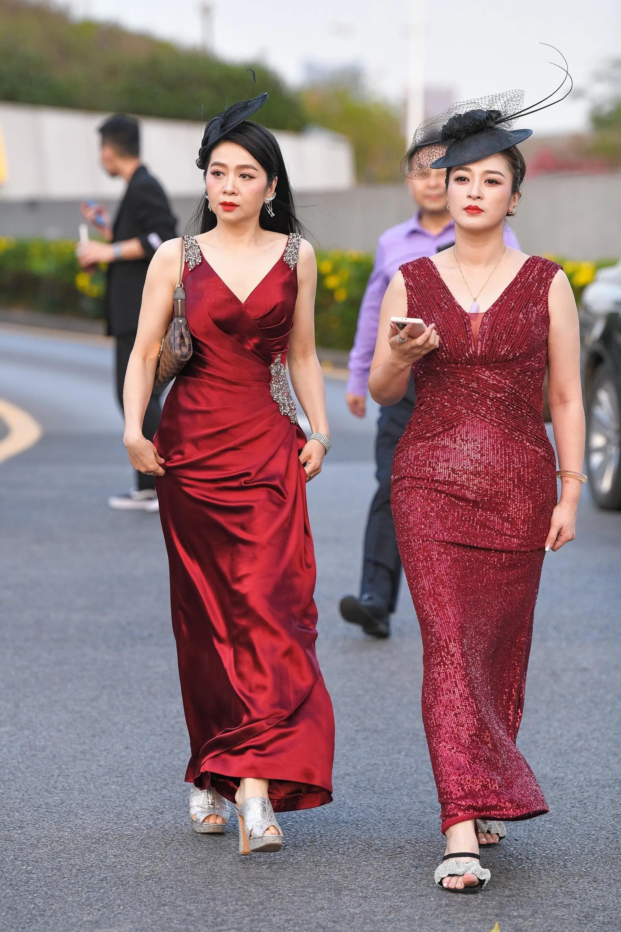 Beautiful woman in red dress with suspenders - iNEWS