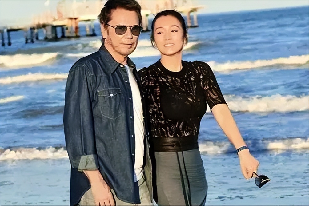 Gong Li and her husband walked the red carpet in Cannes, dressed in a ...