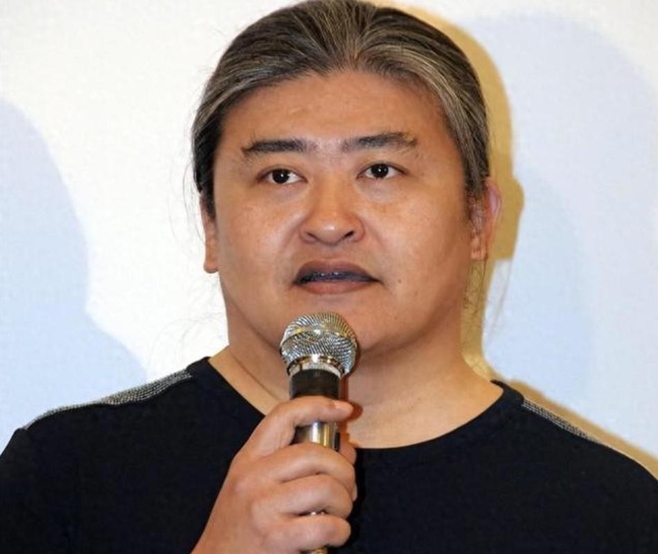Liu Huan is 61 years old and has a head full of white hair. He reflects ...