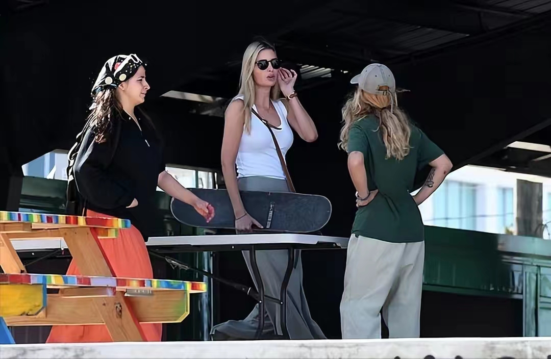 Ivanka looks like a real Barbie after tanning! Wearing a tight vest to ...
