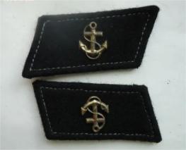 You probably didn't notice the anchor chain on the navy insignia - iNEWS