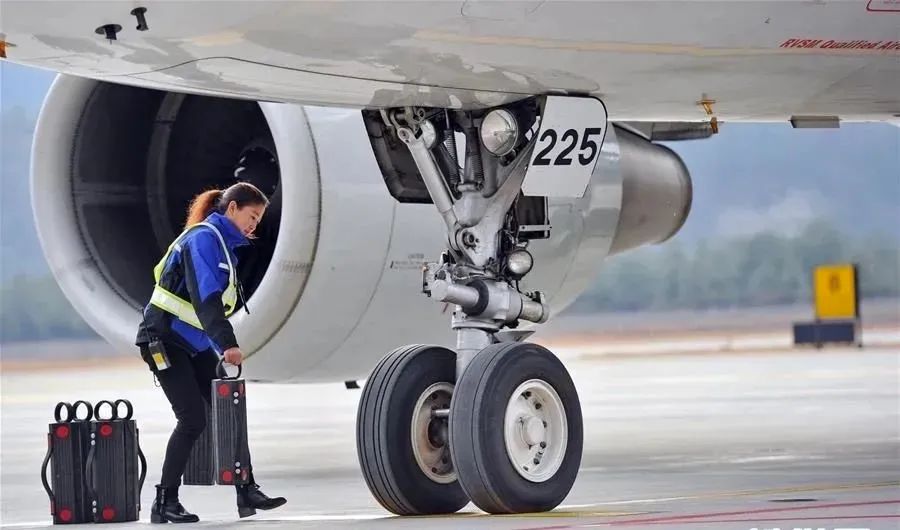 Why is there a red tape hanging from the front wheel of an airplane ...